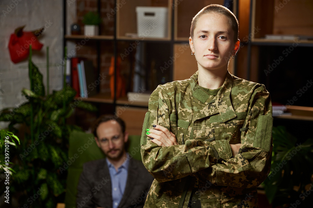 Portrait of female soldier attending meeting with psychologist. Pensive ...