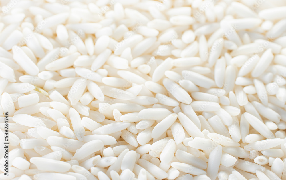 Lots of white rice grains. A pile of white rice grains. Use as a ...