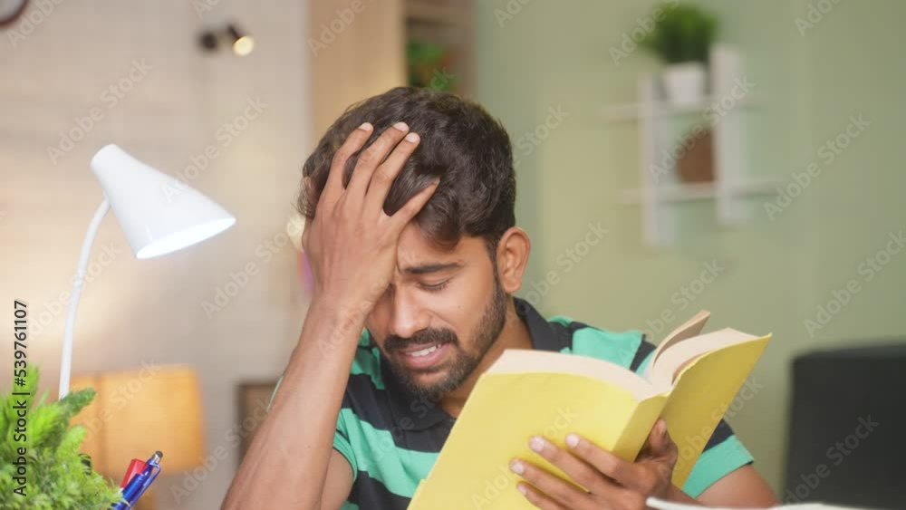 frustrated student while reading books before the examination - concept ...