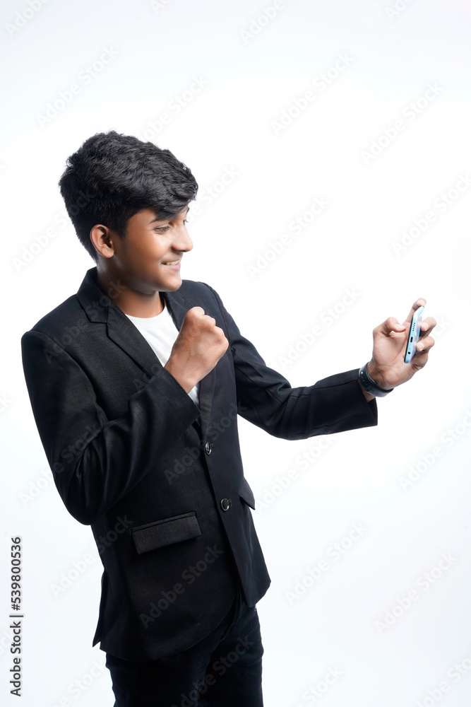 Happy handsome indian man wearing ethnic outfit holding or using mobile ...