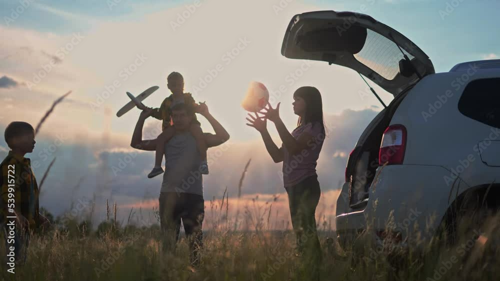 happy family children stand together next to the car watching the ...