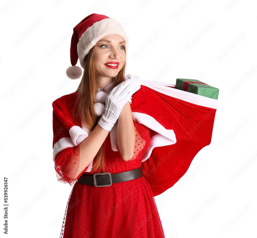 Beautiful young woman in Santa costume with bag of gifts on white ...