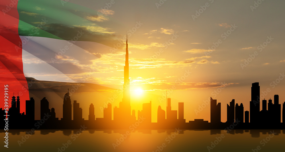 United Arab Emirates flag and Dubai skyline view at sunset. UAE ...