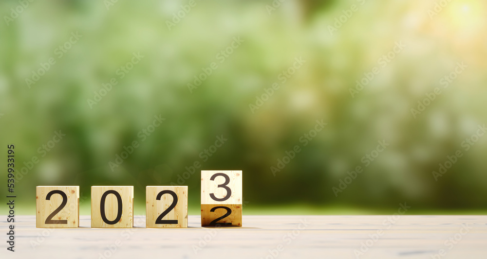 2022 change to 2023 concept wood box flipping on blur background copy ...