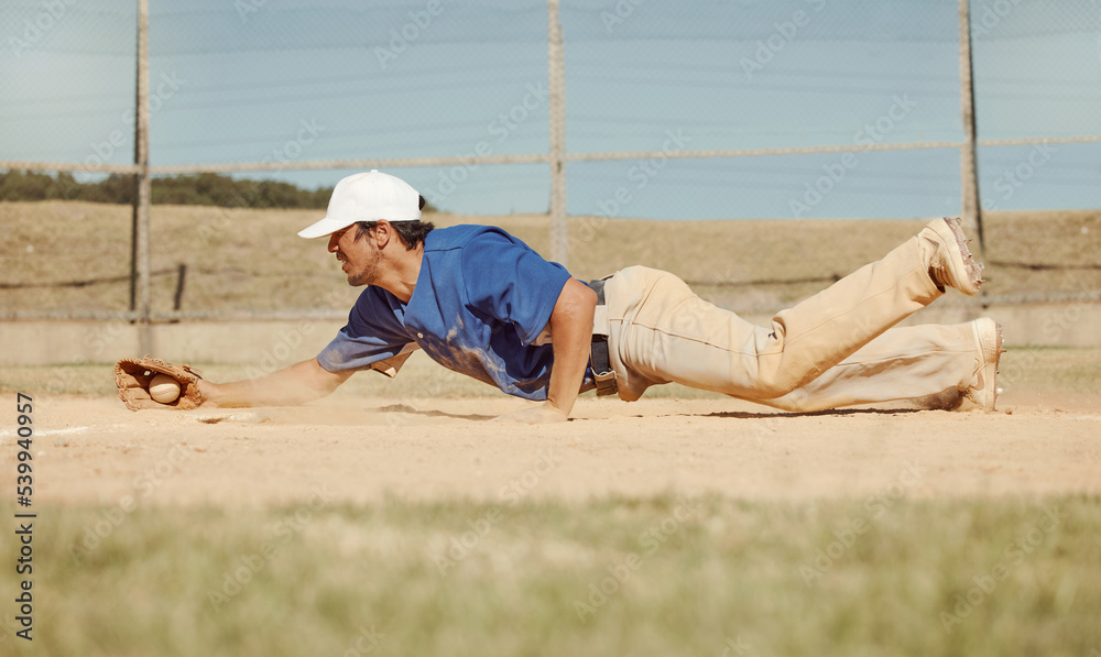 Sports, action and a man catching baseball, sliding in dust on floor ...
