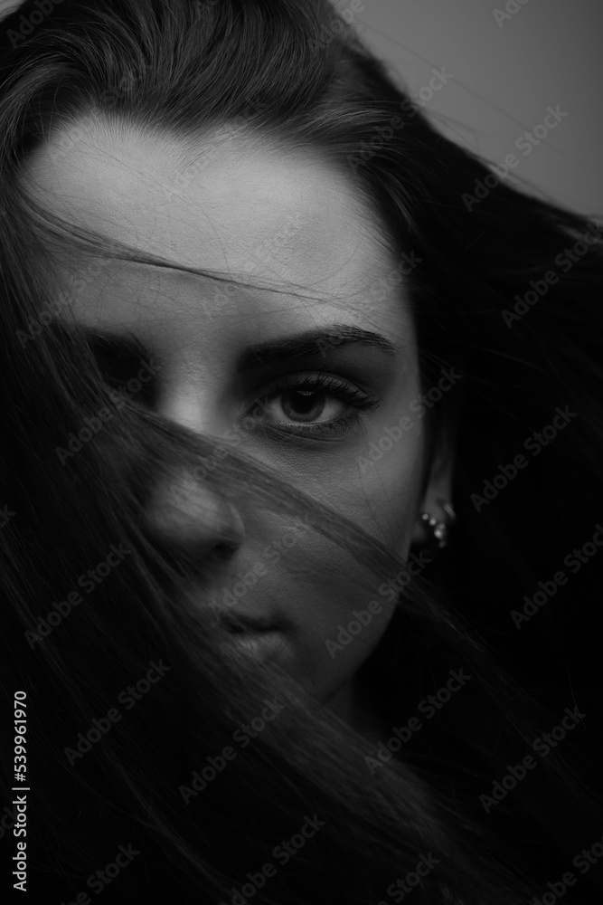 Close-up beautiful woman with seductive look studio portrait. Model ...