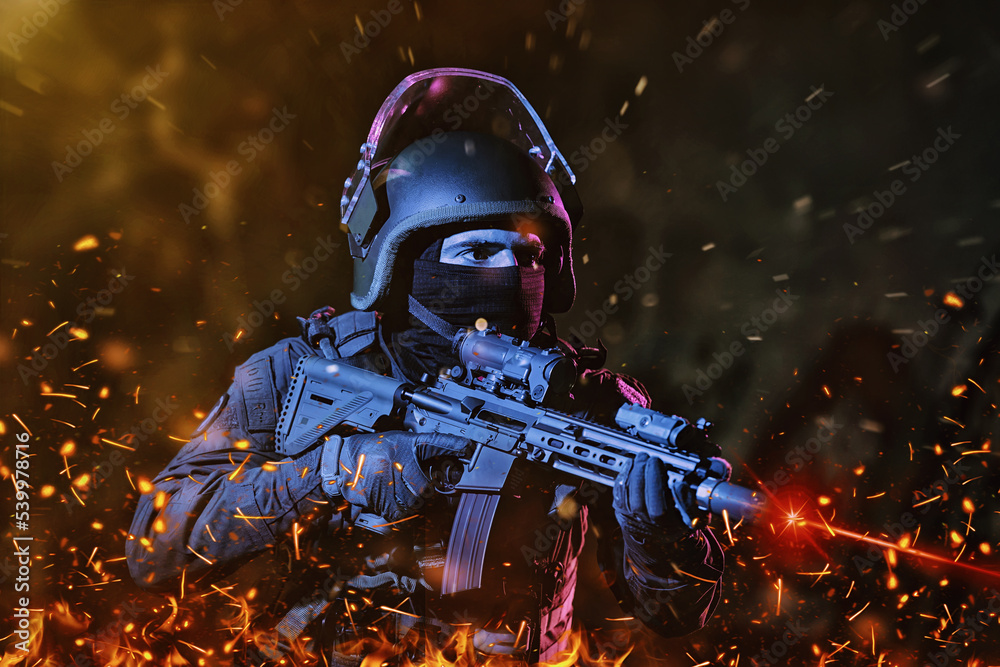 Army soldier in Combat Uniforms with an assault rifle and combat helmet ...