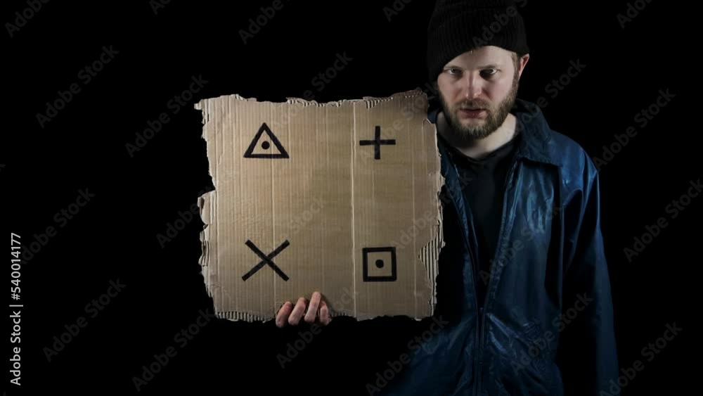 Homeless man holds piece of cardboard with markers for planar tracking ...
