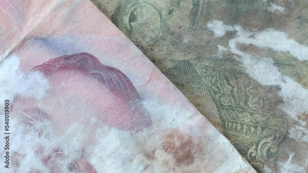Footage 4K. Cash, Thai banknotes, damaged, torn, damaged, currency in ...