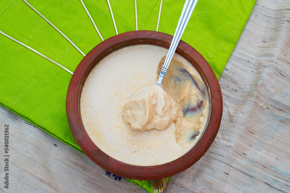 Homemade Mishti Doi or sweet dahi or curd made with milk and sugar or ...