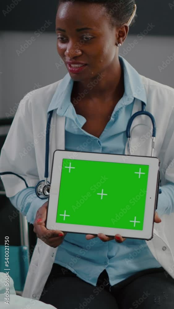 Vertical video: Afro american doctor in uniform discussing with sick ...