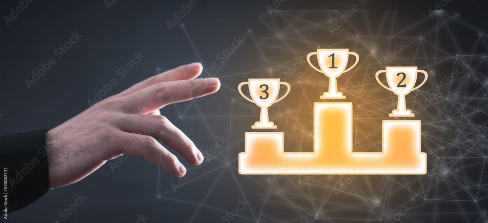 Human hand showing winners podium with three winning cups. Stock Photo ...