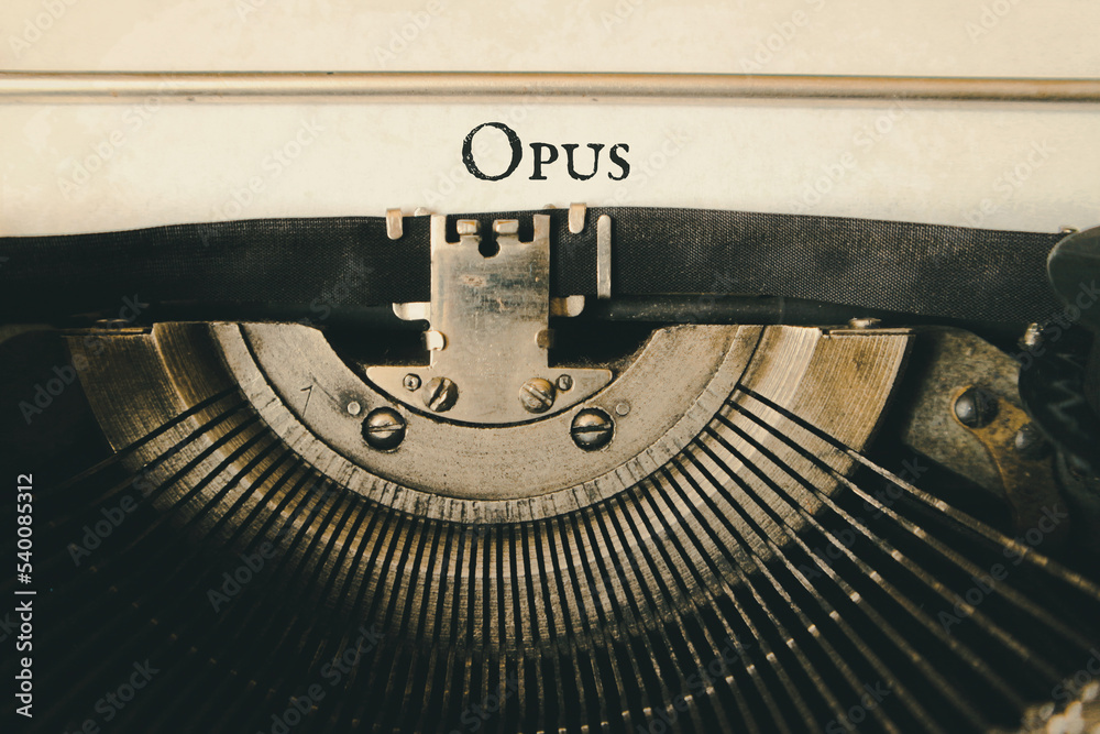 Poster The name Opus is printed on the sheet with an old typewriter ...