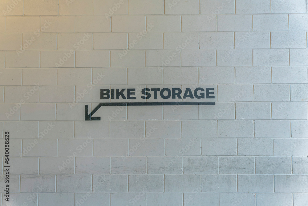 Bike Storage sign with arrow pointing down to an indoor parking garage ...