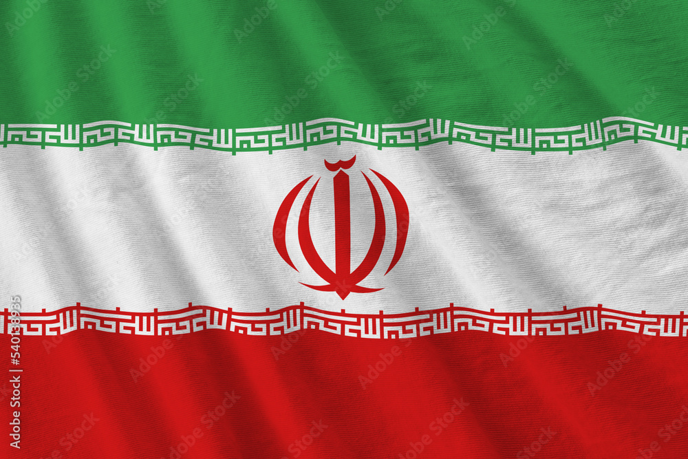 Iran flag with big folds waving close up under the studio light indoors ...