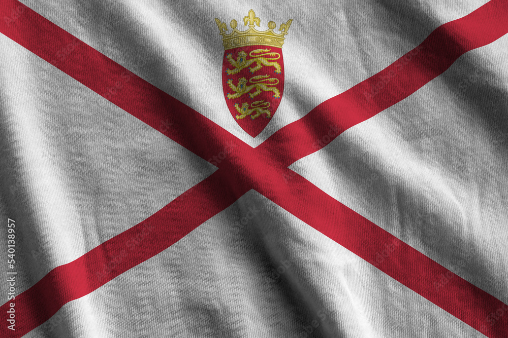 Jersey flag with big folds waving close up under the studio light ...