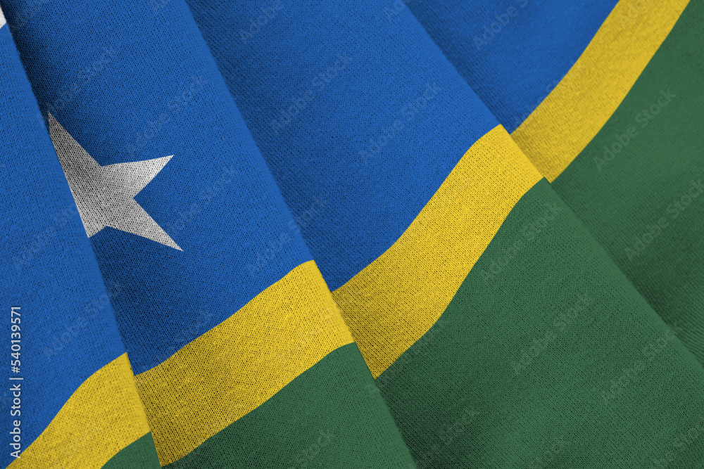 Solomon Islands flag with big folds waving close up under the studio ...