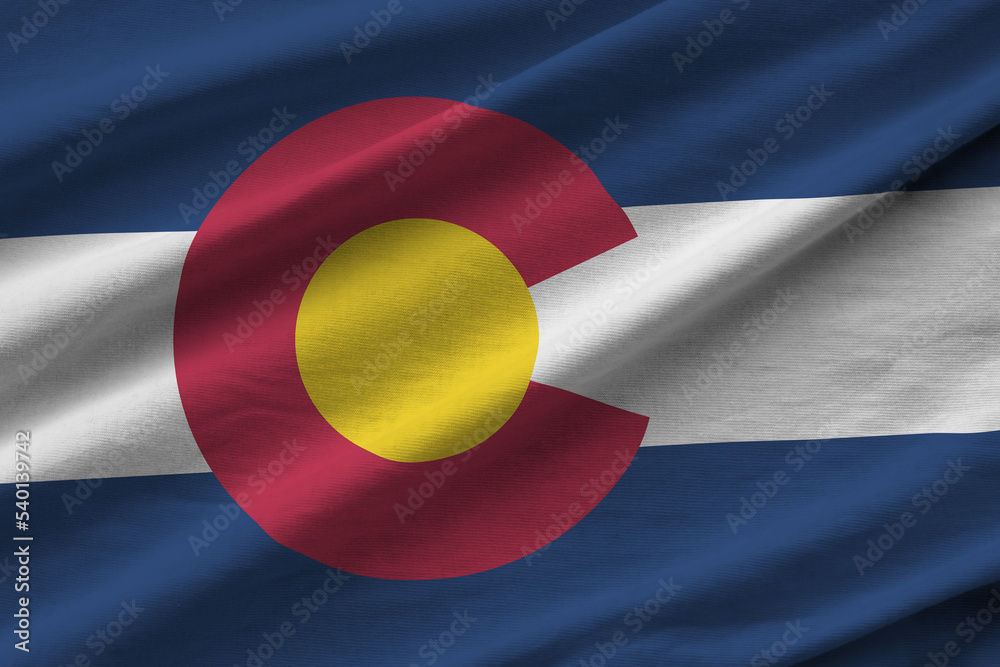 Colorado US state flag with big folds waving close up under the studio ...