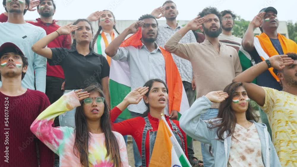 group of audience with Indian flag in hand and painted indian flag on ...