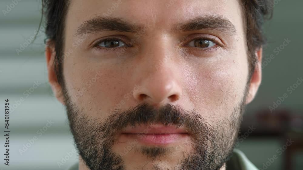 Close-up portrait of a handsome attractive bearded Caucasian young man ...