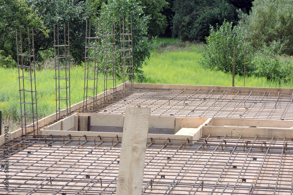 A steel reinforcement for the concrete floor and pillars on the first ...