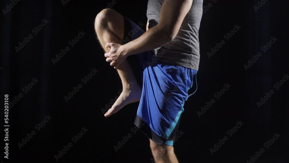Boxer doing training and warm-up exercises. Young boxer doing warm-up ...