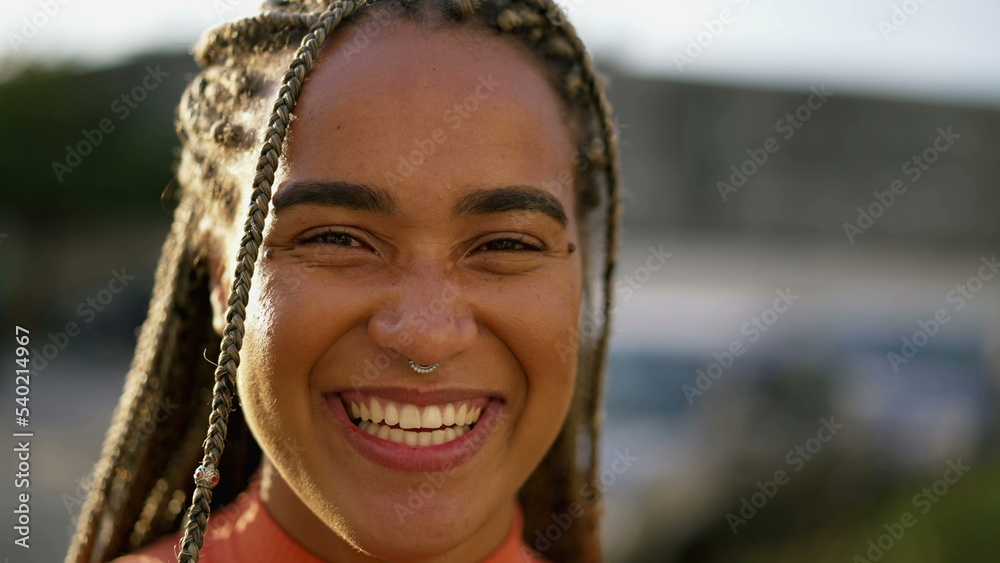 Happy millennial adult girl laughing and smiling. Portrait face closeup ...
