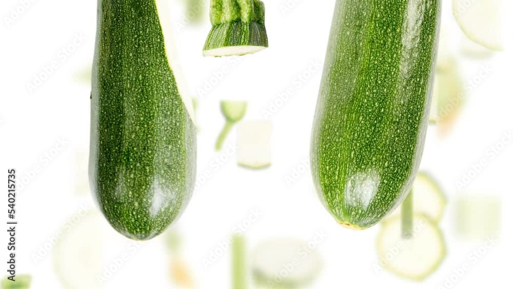 Zucchini vegetable pieces, slices and leaves falling down isolated on ...