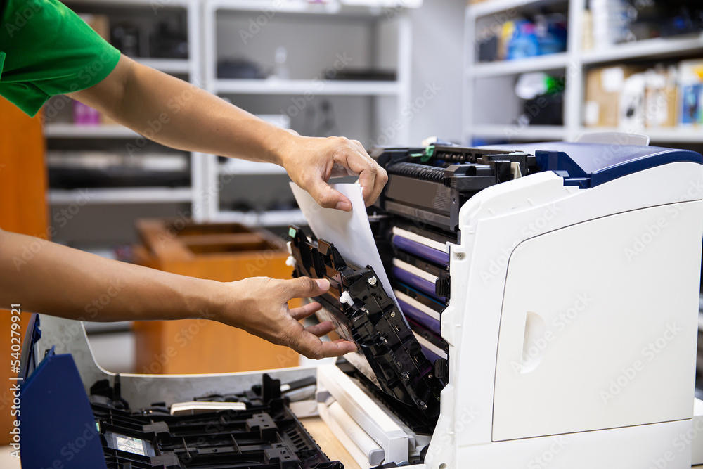 Technician hand open cover photocopier or photocopy to fix copier paper ...