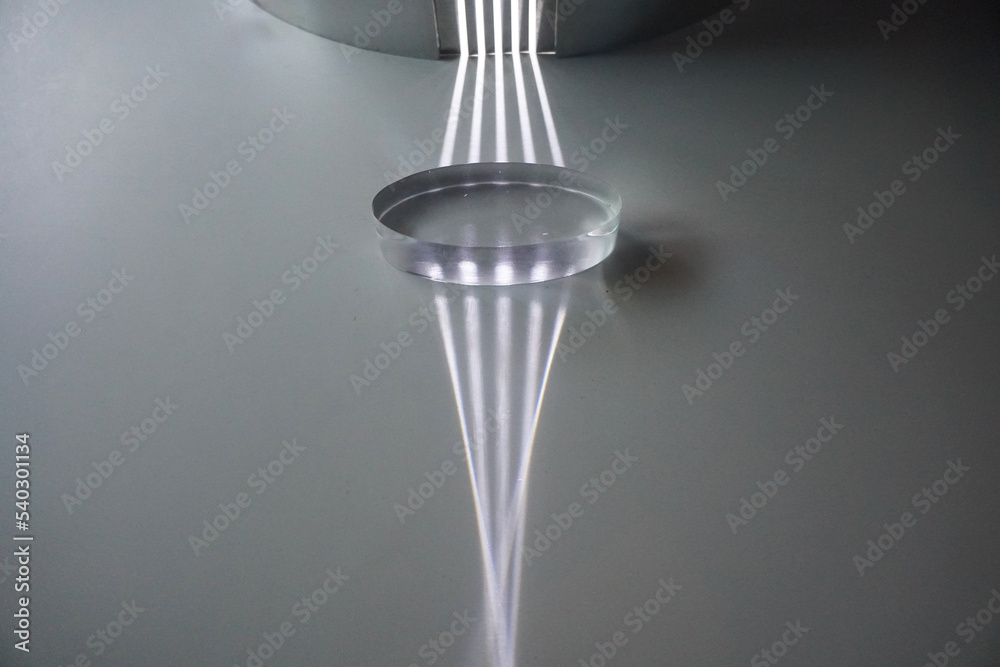 Parallel light passes through a convex lens and is refracted into the ...