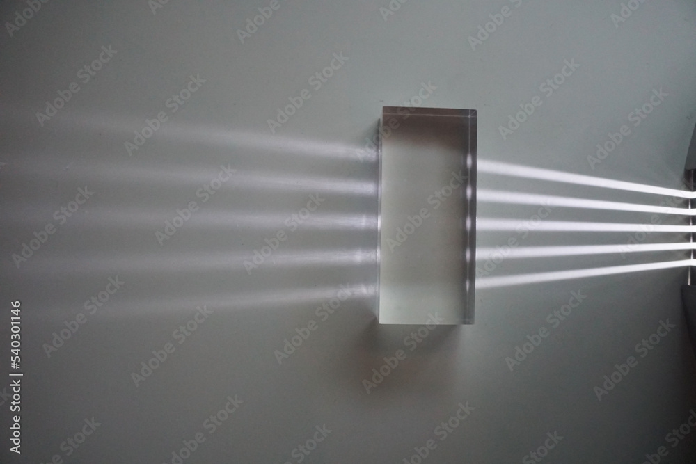 Parallel light refracted through a rectangular transparent plastic rod ...