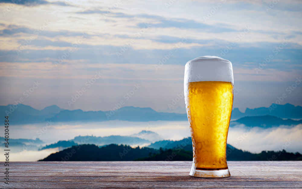 Draft or craft beer in clear glass with beer foam on top Put on set of ...