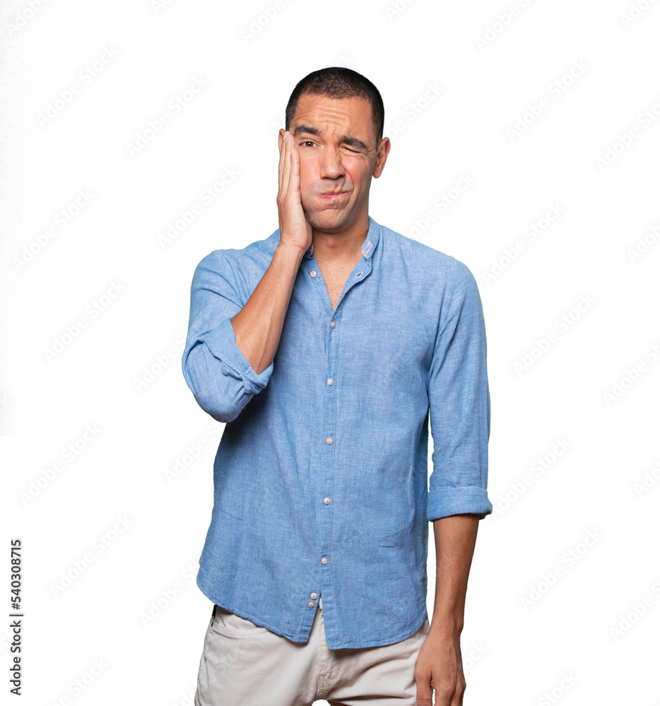 Concerned young man doing a gesture of relief Stock Photo | Adobe Stock