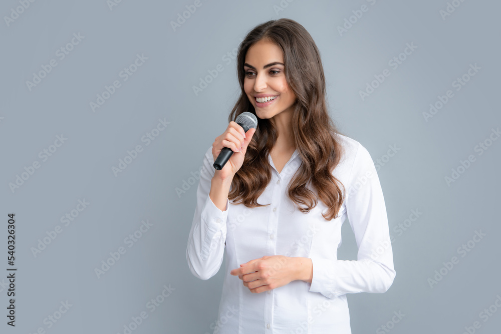 Beautiful business woman is speaking on conference. Microphone speech ...