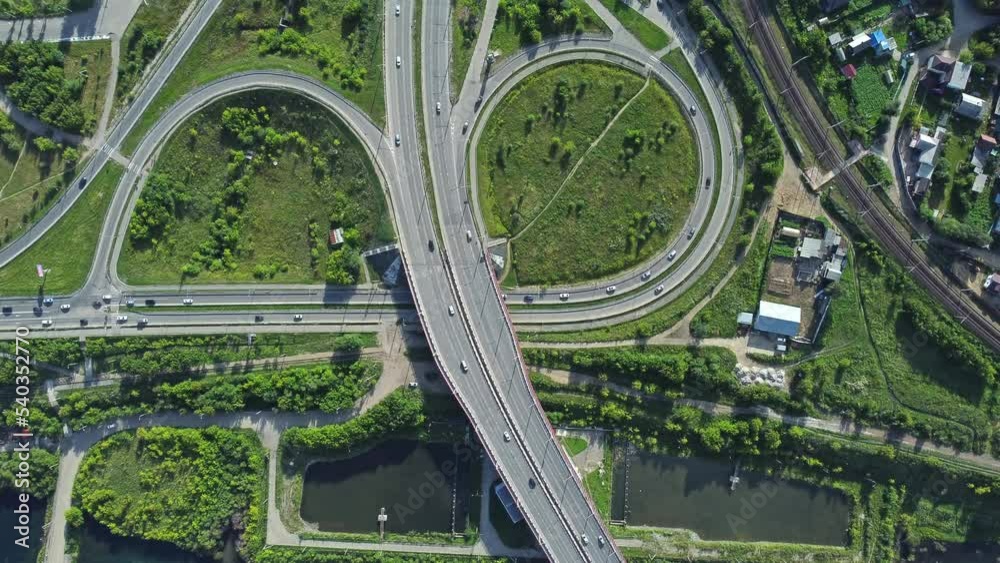 4k Top view of cars drive on intersecting roads outdoors irrl. Aerial ...