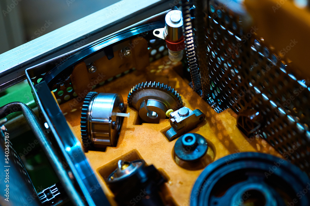 Various parts for assembly during the assembly of an automobile engine ...