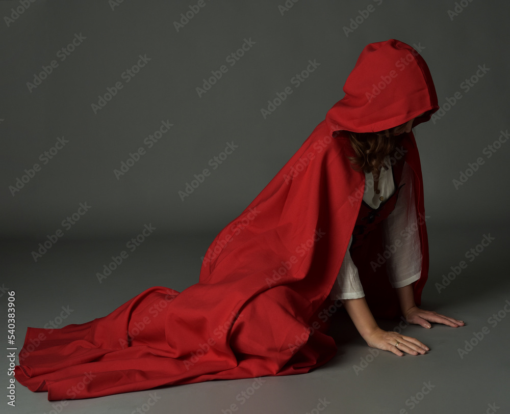 Full length portrait of beautiful brunette woman wearing red medieval ...