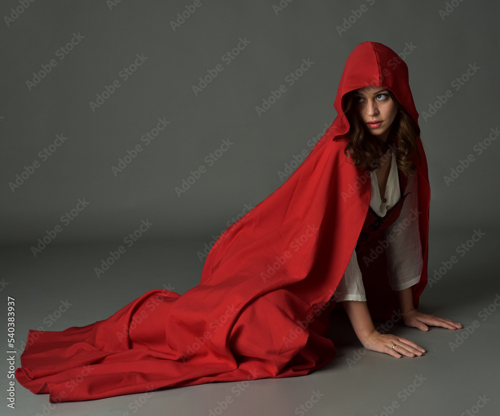 Full length portrait of beautiful brunette woman wearing red medieval ...