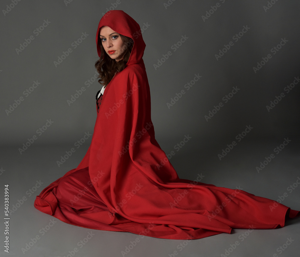 Full length portrait of beautiful brunette woman wearing red medieval ...