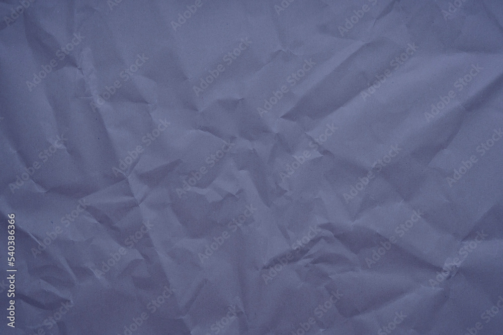 Abstract blue paper wrinkled or crumpled texture background close-up ...