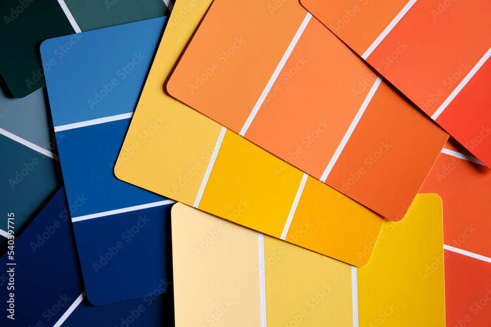 Generic color swatches scattered on a table. Swatches are in various ...