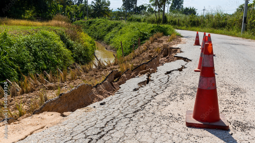 Landslide caused by rains occurs broken road asphalt. Broken asphalt ...