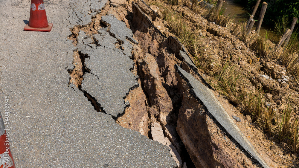Landslide caused by rains occurs broken road asphalt. Broken asphalt ...