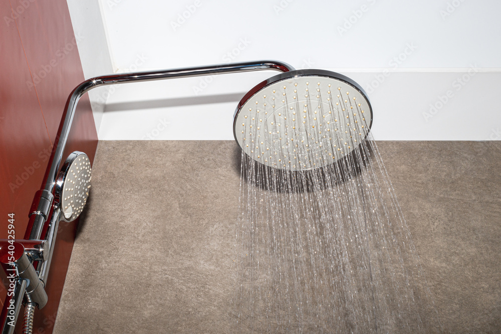Luxury rain shower in the home bathroom with falling water. Water ...