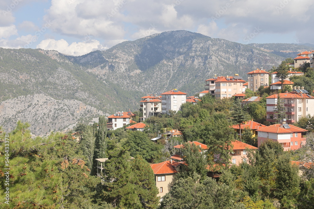 Mountainside village with Mediterranean design, surrounded by plants ...