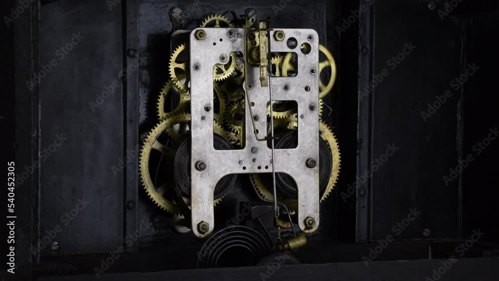 Vintage table clock mechanism. Old metal gears and sprockets ...