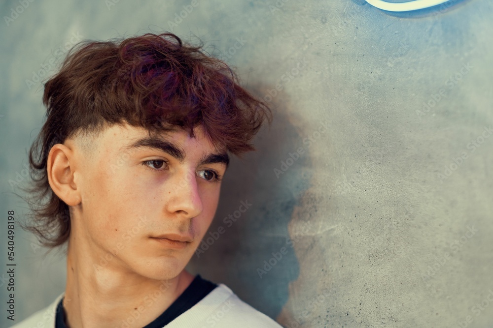 Portrait of a young Caucasian boy with a fresh mullet haircut ภาพถ่าย ...