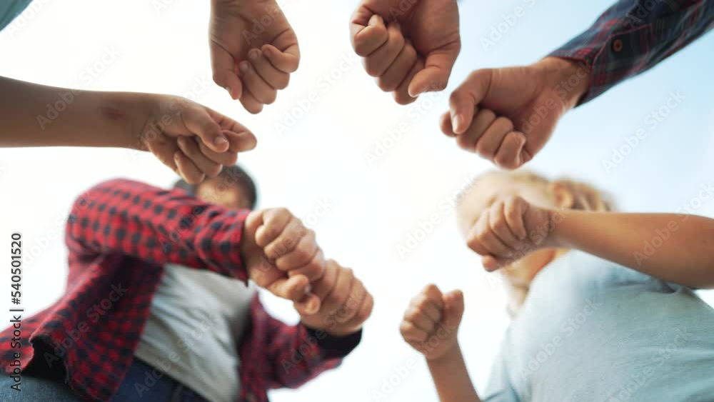 The family makes punches together. Family teamwork concept, hands on ...