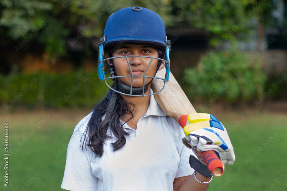 Portrait Of A Female Cricketer Holding A Cricket Bat Stock Photo ...
