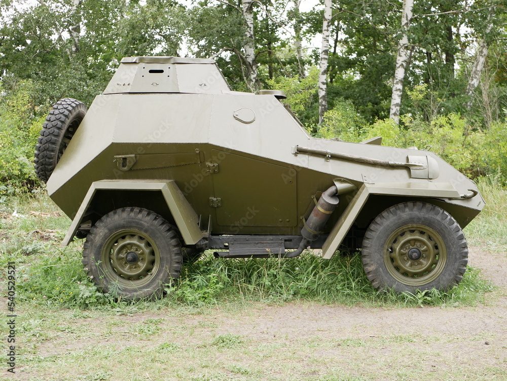 A small four-wheeled armored car with a swivel turret without a machine ...